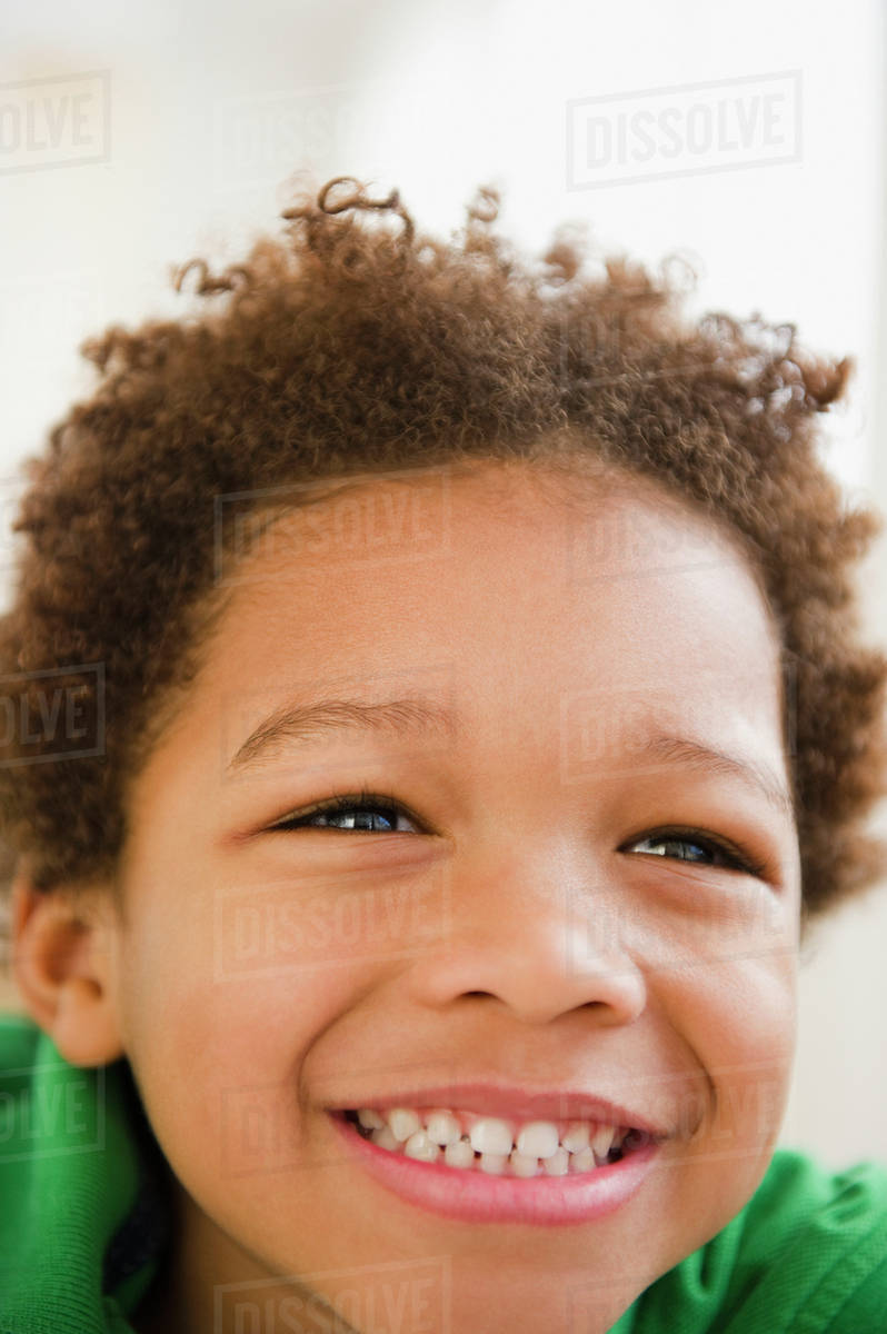 Black boy grinning - Royalty-free Stock Photo | Dissolve