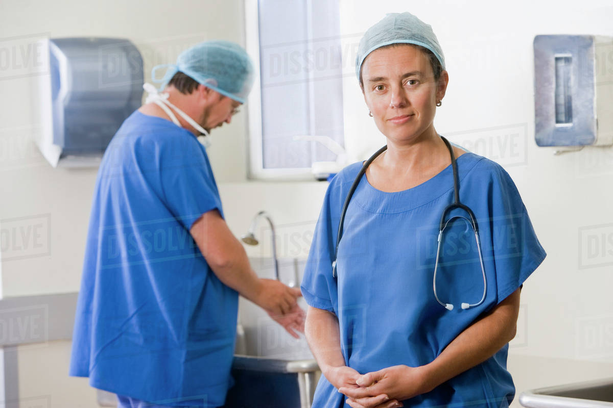 Surgeons scrubbing in before operating - Stock Photo - Dissolve