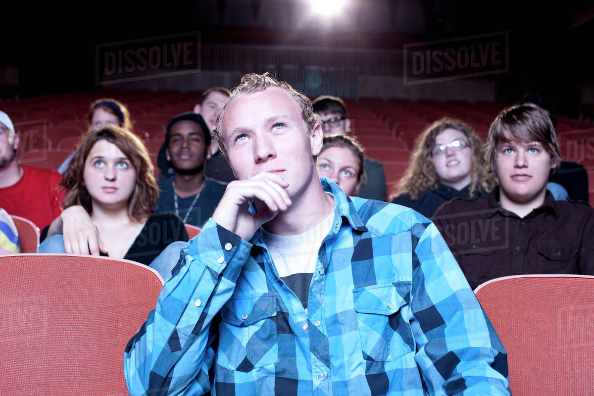 Caucasian man watching movie in theater - Royalty-free Stock Photo ...