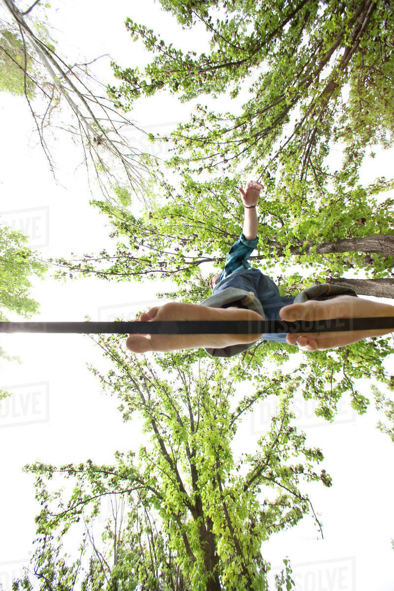 Caucasian man balancing on rope in park - Royalty-free Stock Photo ...