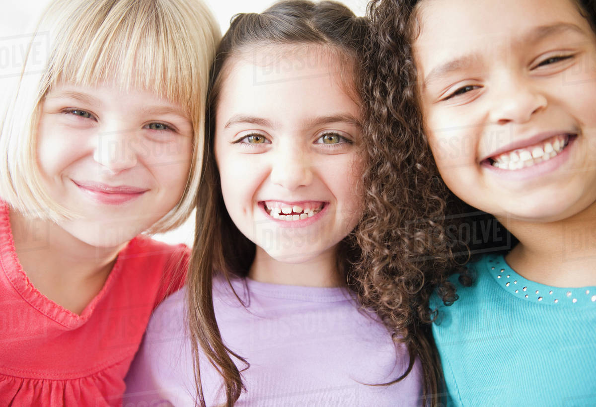 Children grinning together - Royalty-free Stock Photo | Dissolve