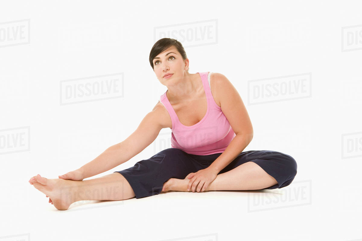 Portrait of woman stretching - Royalty-free Stock Photo | Dissolve