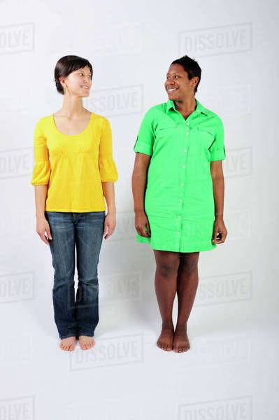 Women standing side by side - Royalty-free Stock Photo | Dissolve