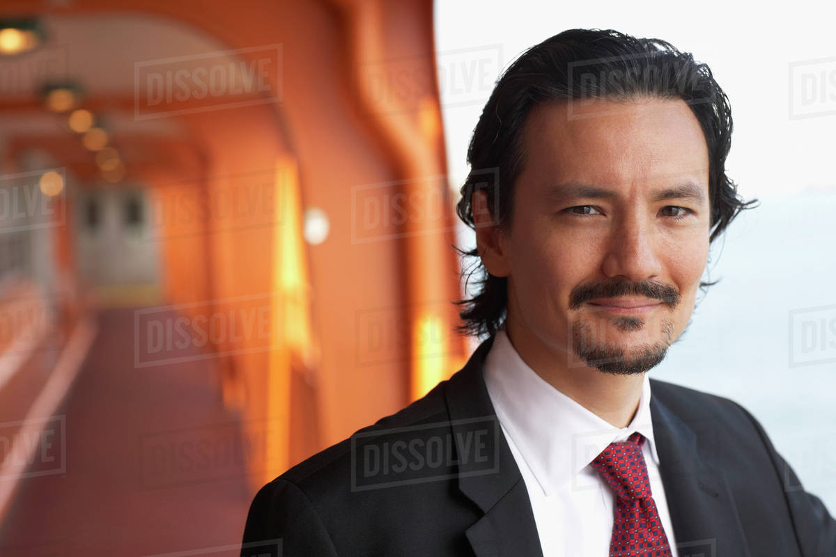 Smiling mixed race businessman - Stock Photo - Dissolve