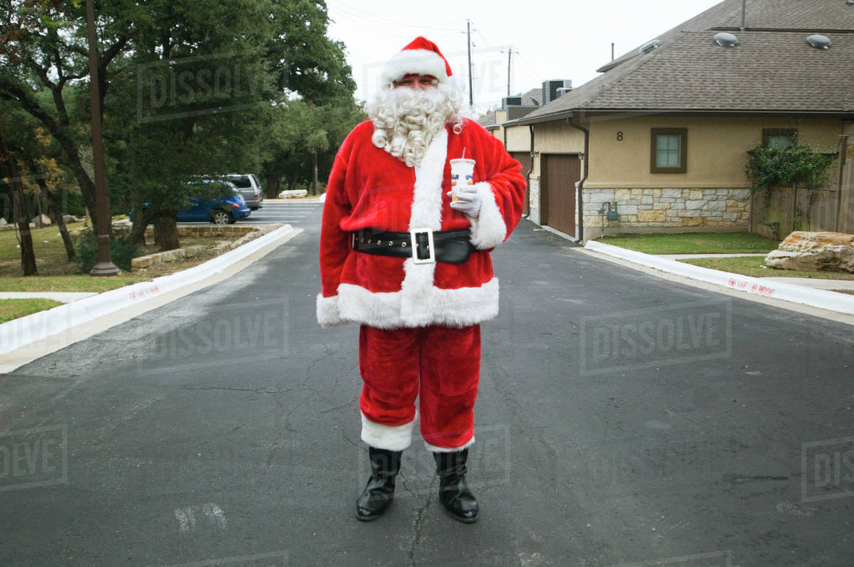 Santa standing in road - Stock Photo - Dissolve