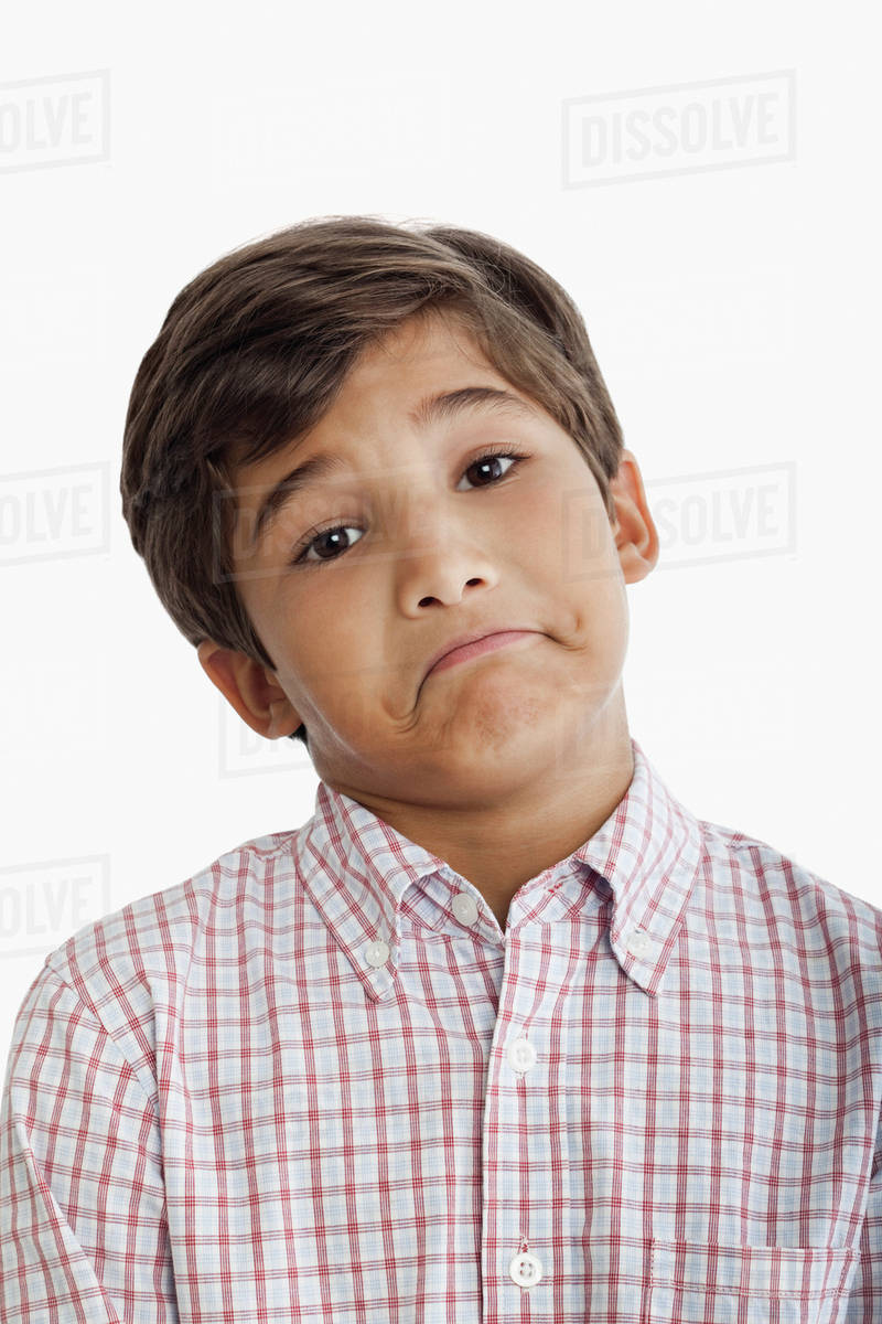 Uncertain Hispanic boy - Royalty-free Stock Photo | Dissolve