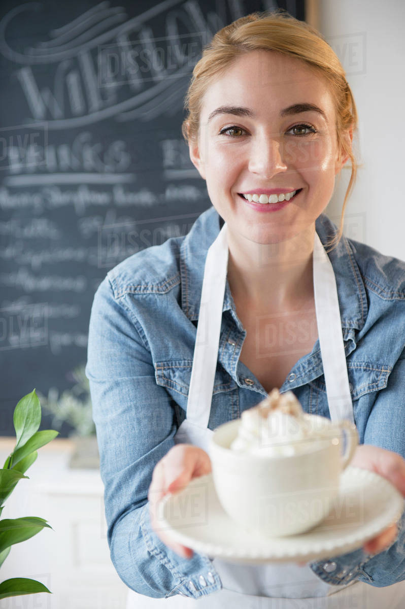 Caucasian barista serving coffee drink in cafe - Royalty-free Stock ...