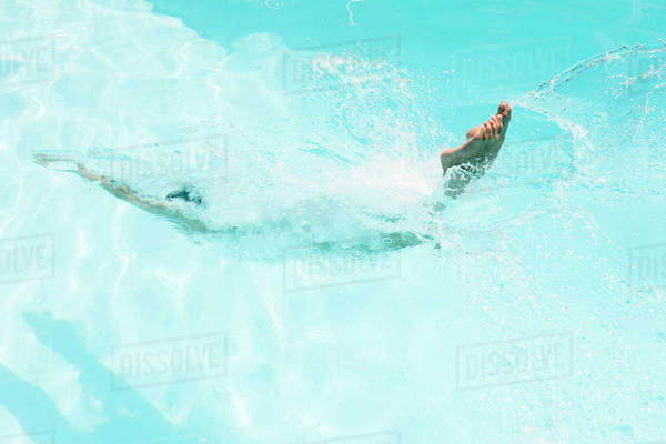 Caucasian woman diving in swimming pool - Royalty-free Stock Photo ...