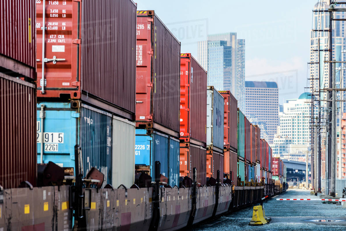 Train carrying containers on train tracks - Royalty-free Stock Photo ...