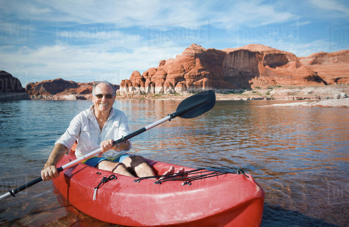 Senior man sitting in kayak - Royalty-free Stock Photo | Dissolve