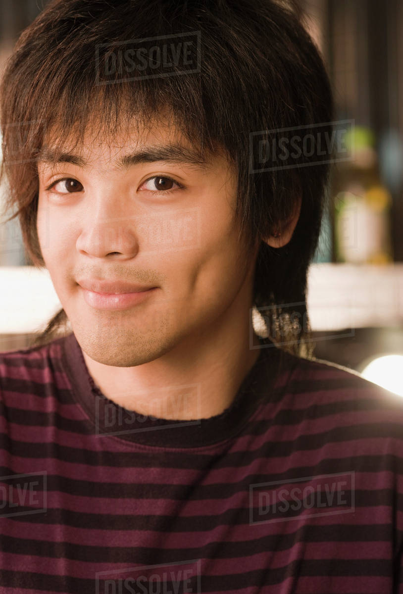 Asian man smiling - Royalty-free Stock Photo | Dissolve