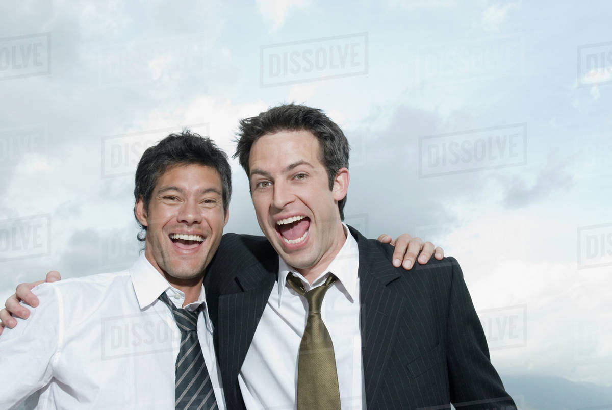Hispanic businessmen hugging - Royalty-free Stock Photo | Dissolve