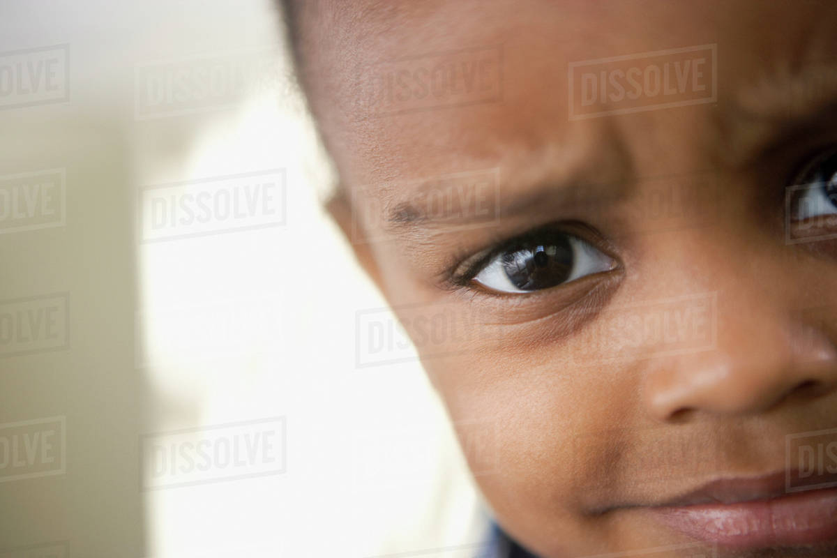 Frowning African boy - Stock Photo - Dissolve