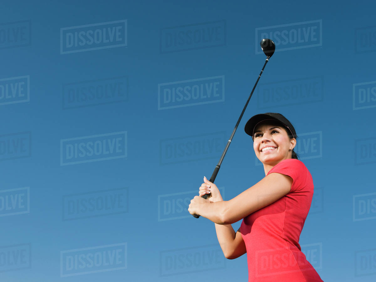 Native American swinging golf club - Stock Photo - Dissolve