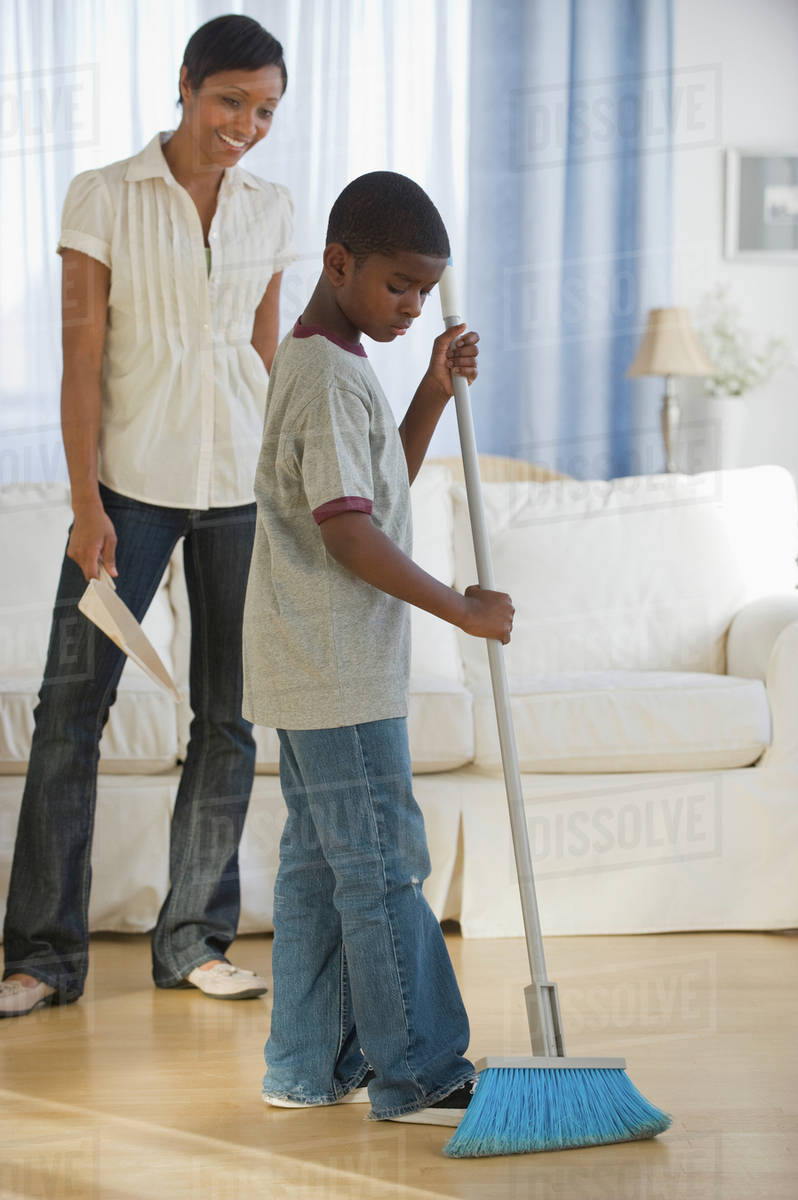 African mother and son doing housework together - Royalty-free Stock ...