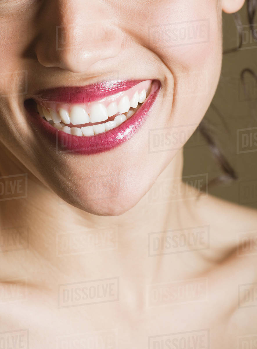 Close-up of a young woman's smile - Royalty-free Stock Photo | Dissolve
