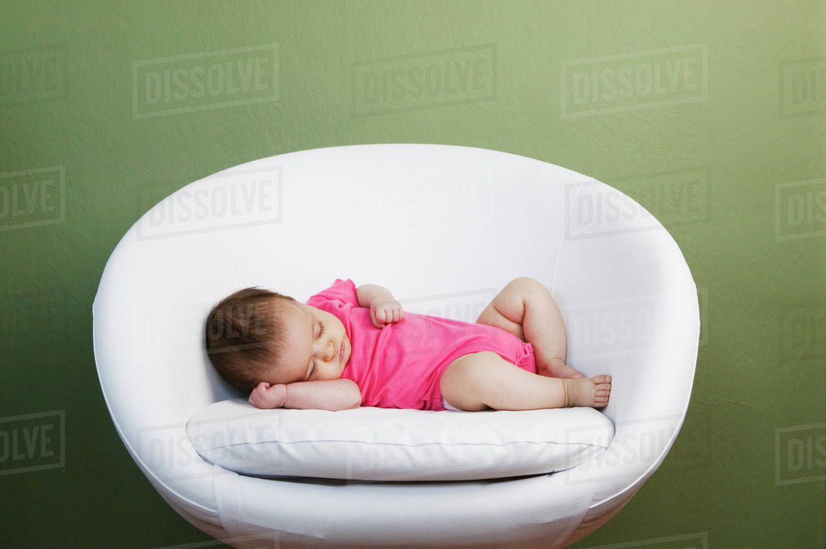 Baby sleeping on chair - Royalty-free Stock Photo | Dissolve