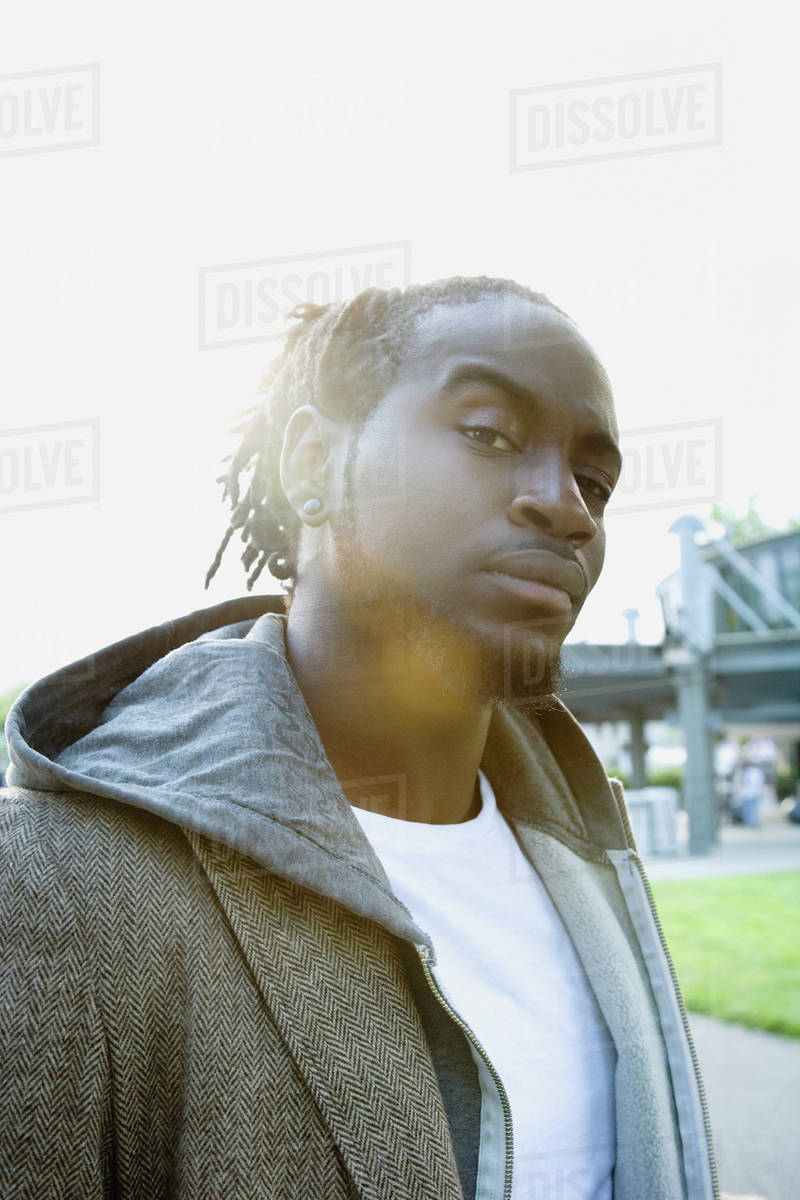 Portrait of African man in sunlight - Stock Photo - Dissolve