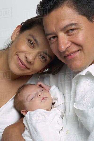 Portrait of Hispanic parents and baby - Royalty-free Stock Photo | Dissolve