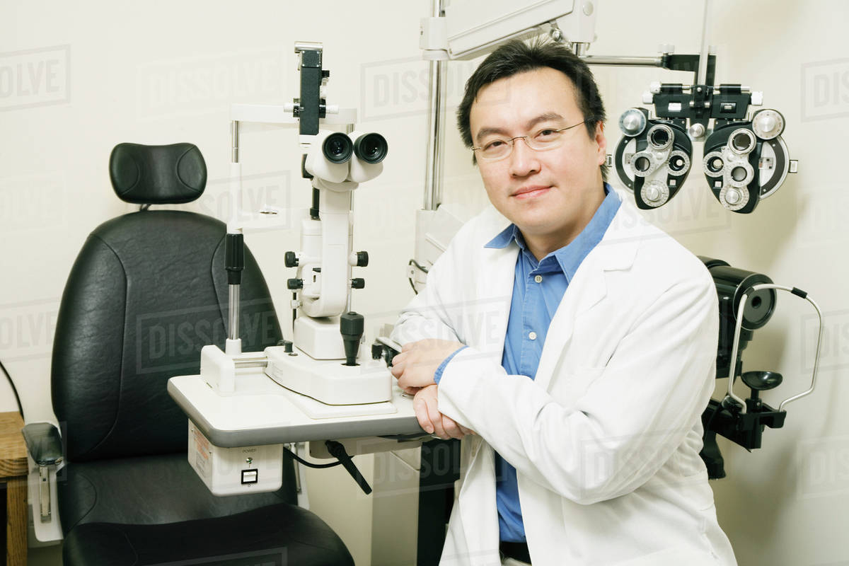Asian male optometrist in office - Royalty-free Stock Photo | Dissolve