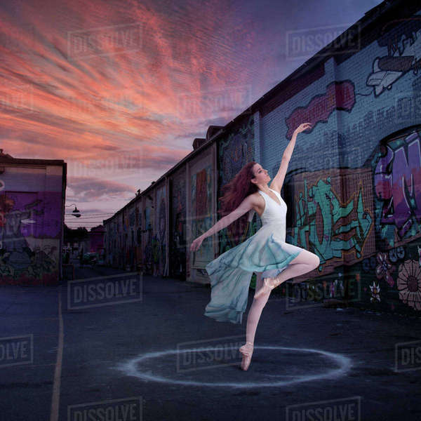 Caucasian ballerina dancing in circle - Royalty-free Stock Photo | Dissolve