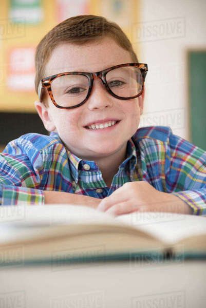 Caucasian student wearing eyeglasses in classroom - Royalty-free Stock ...