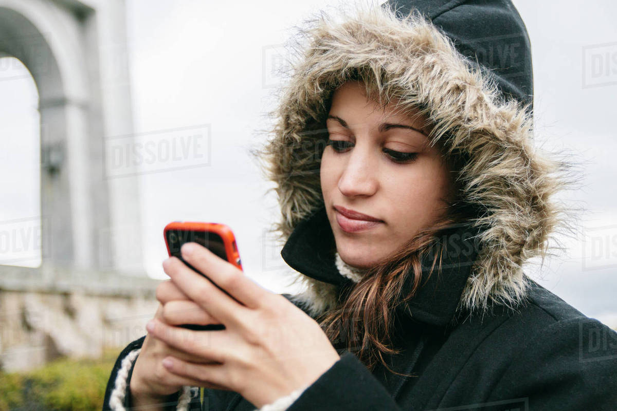 Caucasian woman using cell phone - Royalty-free Stock Photo | Dissolve