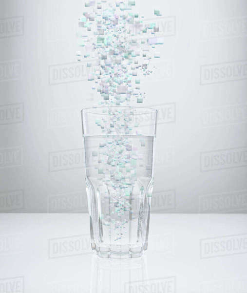 Blocks raining into water glass - Royalty-free Stock Photo | Dissolve
