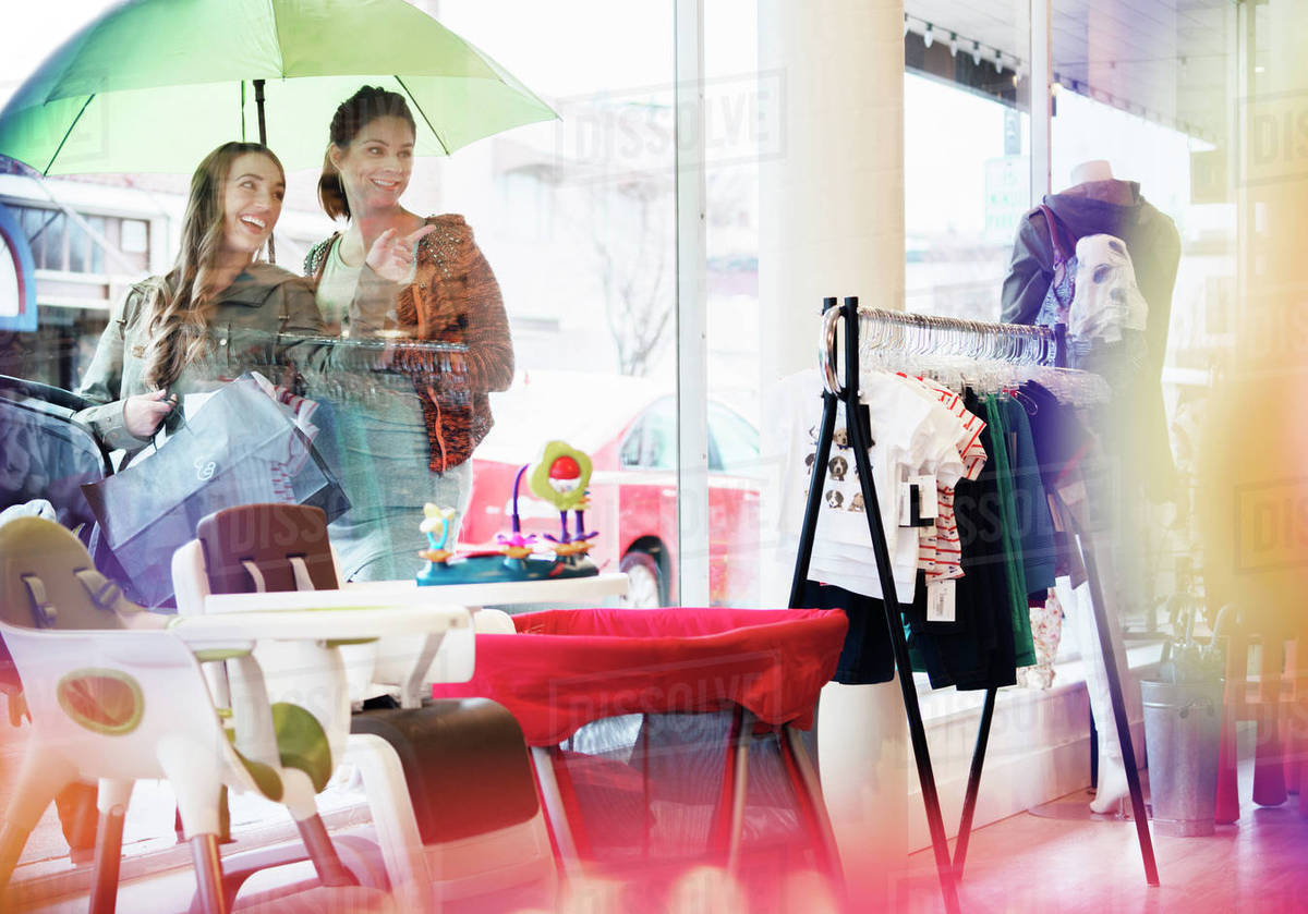 Caucasian women window shopping outside store - Royalty-free Stock ...