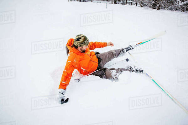 Caucasian man falling on cross-country skis in snow - Royalty-free ...