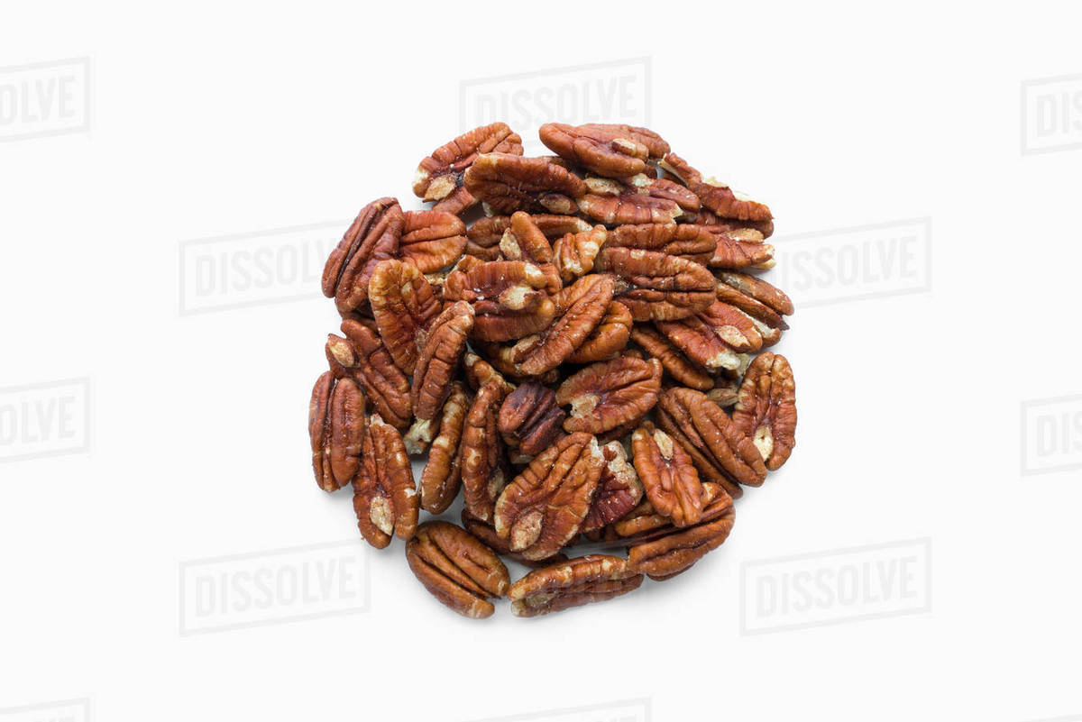 Pile of pecans in shape of a circle - Stock Photo - Dissolve