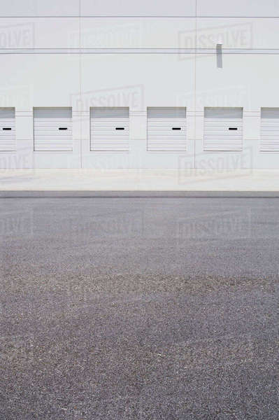 Loading docks and empty parking lot - Royalty-free Stock Photo | Dissolve