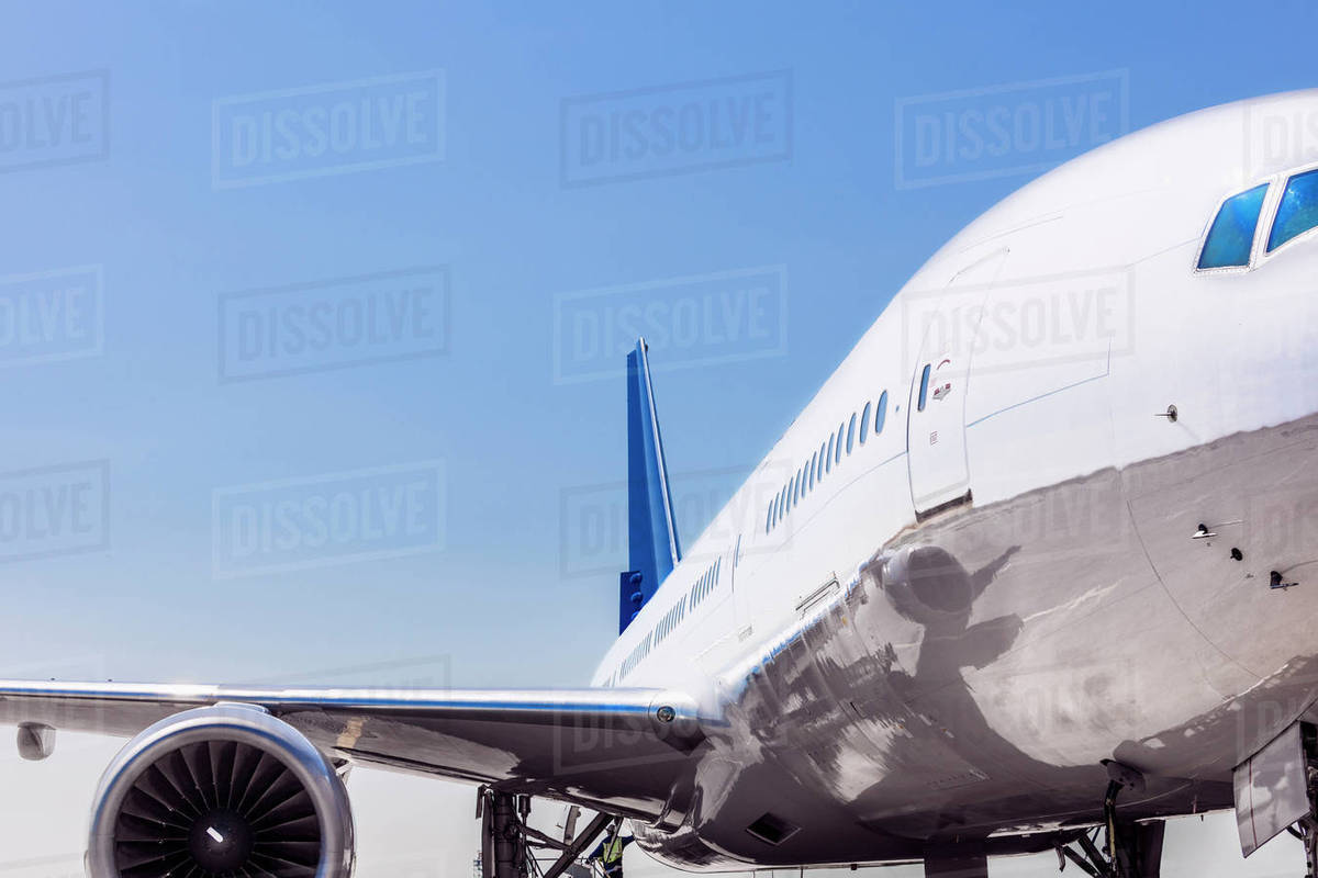Wing and engine on airplane - Stock Photo - Dissolve