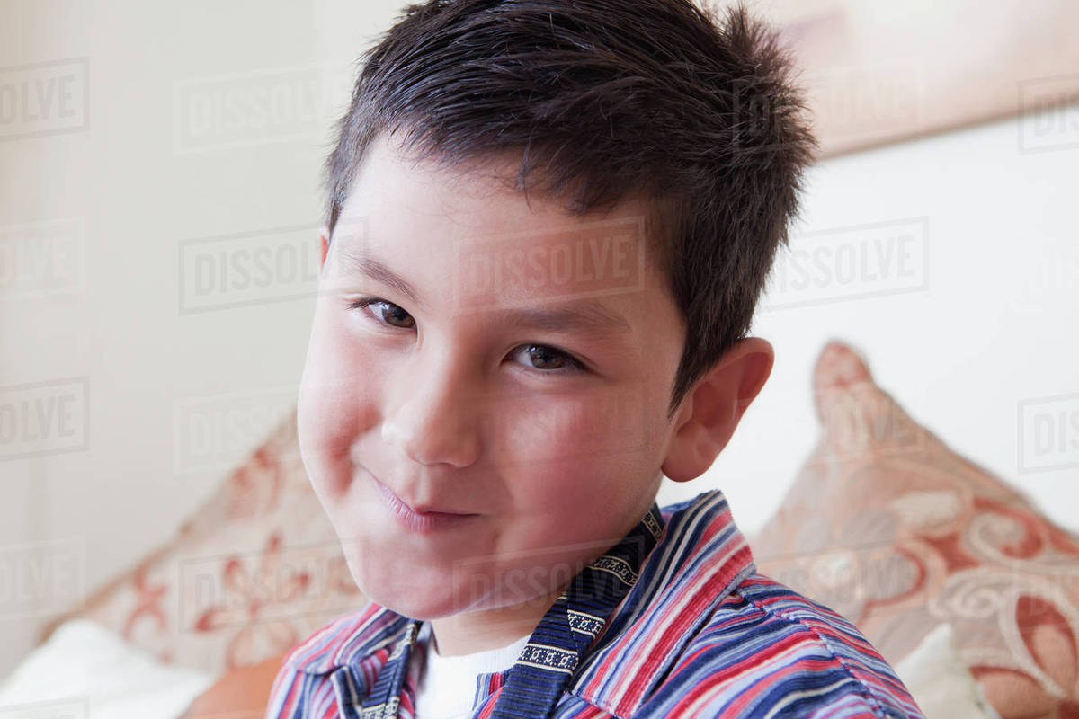 Hispanic boy smiling - Stock Photo - Dissolve