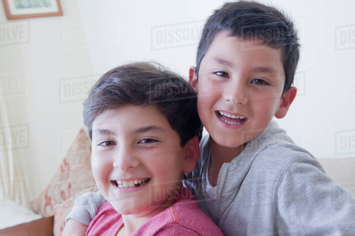 Hispanic brothers smiling - Royalty-free Stock Photo | Dissolve