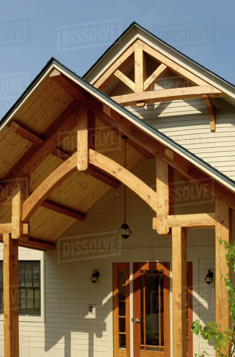 Home front entrance with wooden overhang - Royalty-free Stock Photo ...