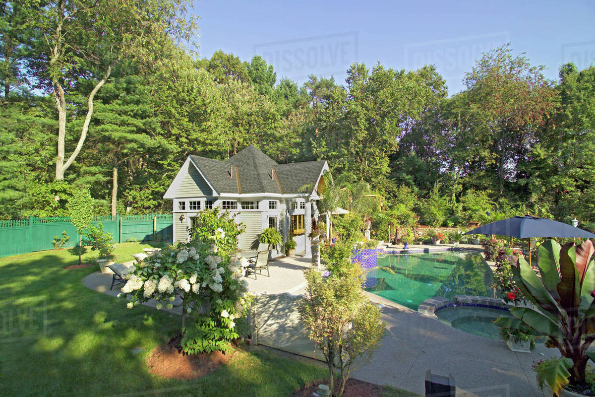 Swimming pool in front of pool house - Royalty-free Stock Photo | Dissolve