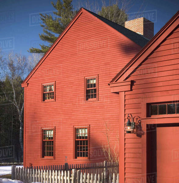 Side view red saltbox style home - Stock Photo - Dissolve