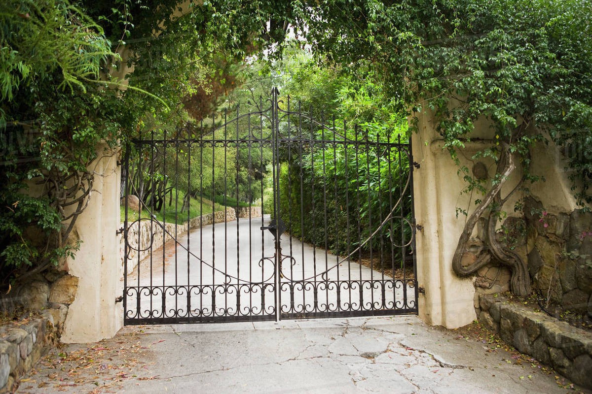 Large closed wrought iron gate - Royalty-free Stock Photo | Dissolve