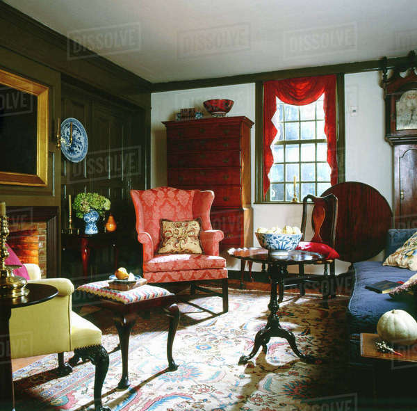 Armchairs, stool, tables in living room of 18th century house - Royalty ...