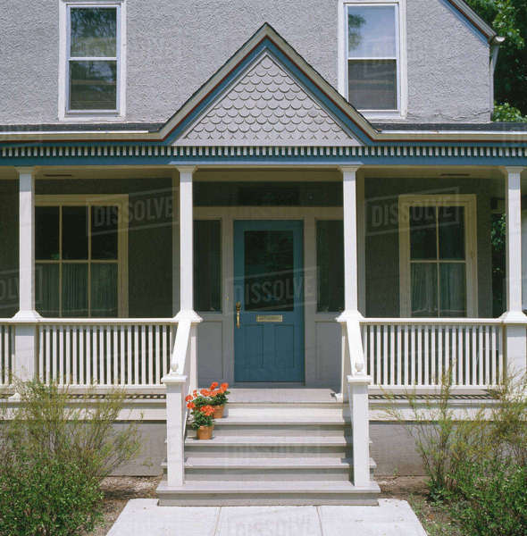 Front porch of gray stucco house with dark blue trim - Stock Photo ...