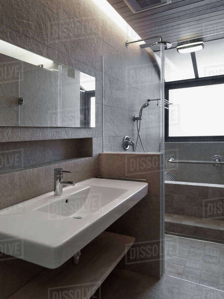 Modern bathroom with large sink - Stock Photo - Dissolve