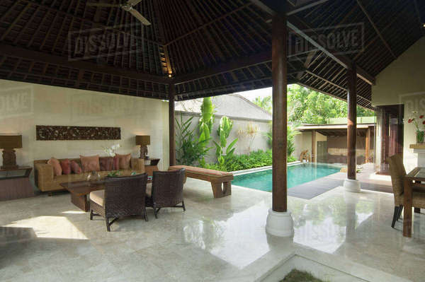 Contemporary sitting area opened up to private pool - Stock Photo ...