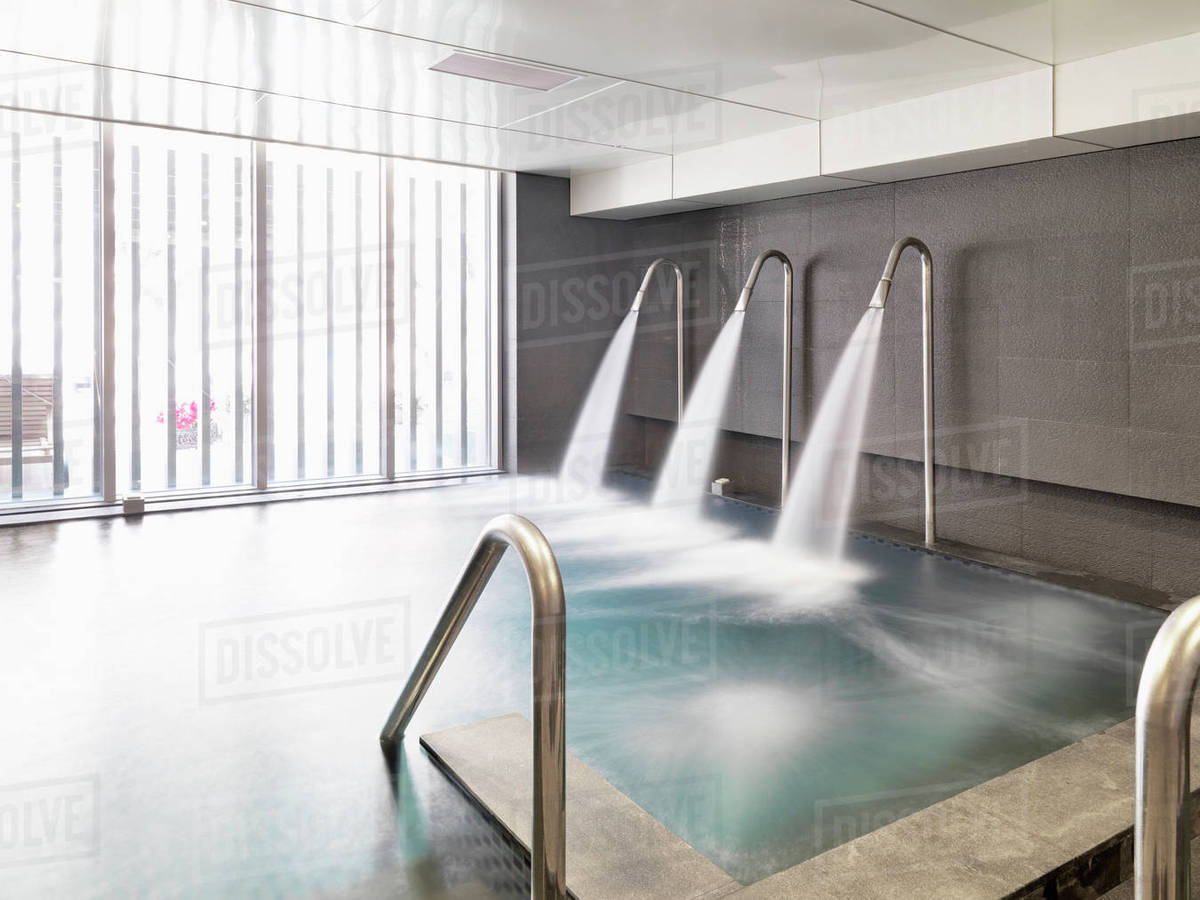 Pool with large water jets - Royalty-free Stock Photo | Dissolve