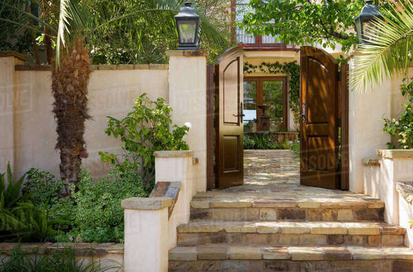 Front Gate and Steps to Spanish Style Home - Stock Photo - Dissolve