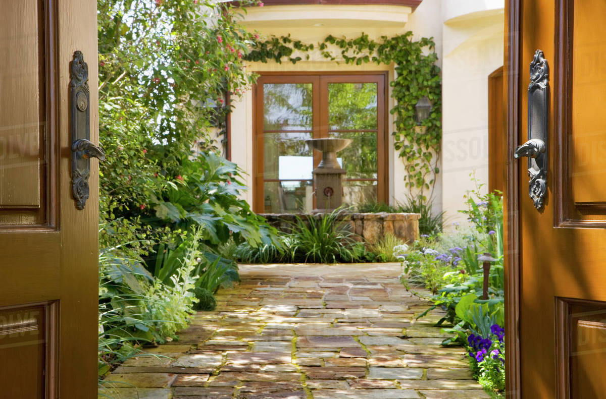 Front Gate Open to Home Courtyard - Royalty-free Stock Photo | Dissolve