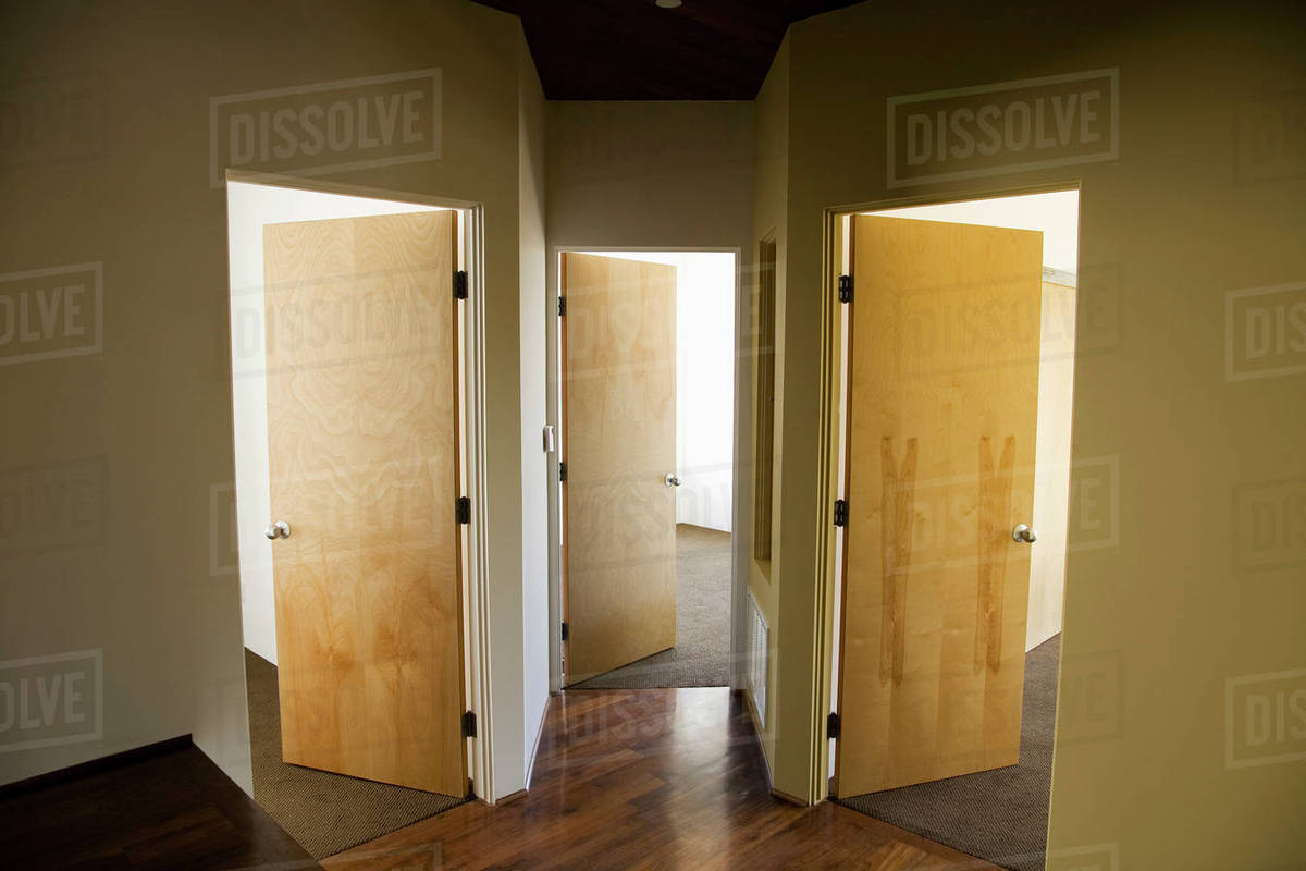 Three Open Doors in Modern Hallway - Royalty-free Stock Photo | Dissolve