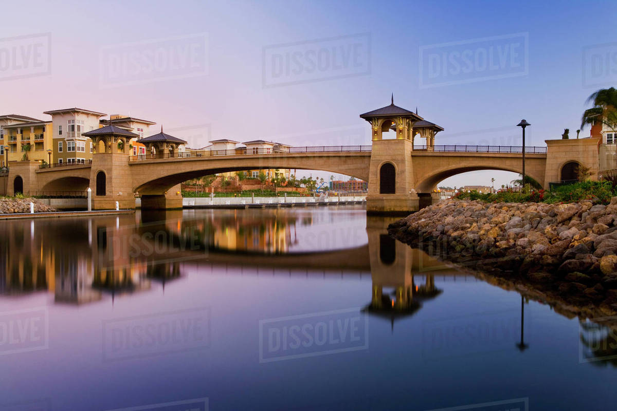 View of bridge with towers across channel - Stock Photo - Dissolve
