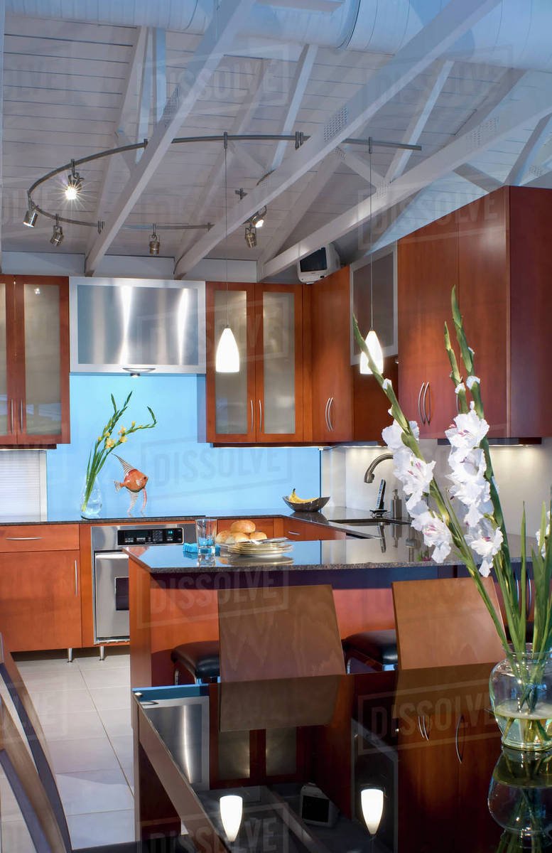 Modern kitchen with rafters - Stock Photo - Dissolve