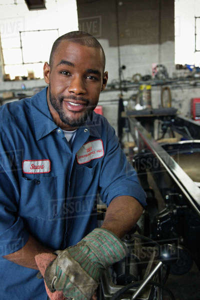African mechanic in repair shop - Stock Photo - Dissolve